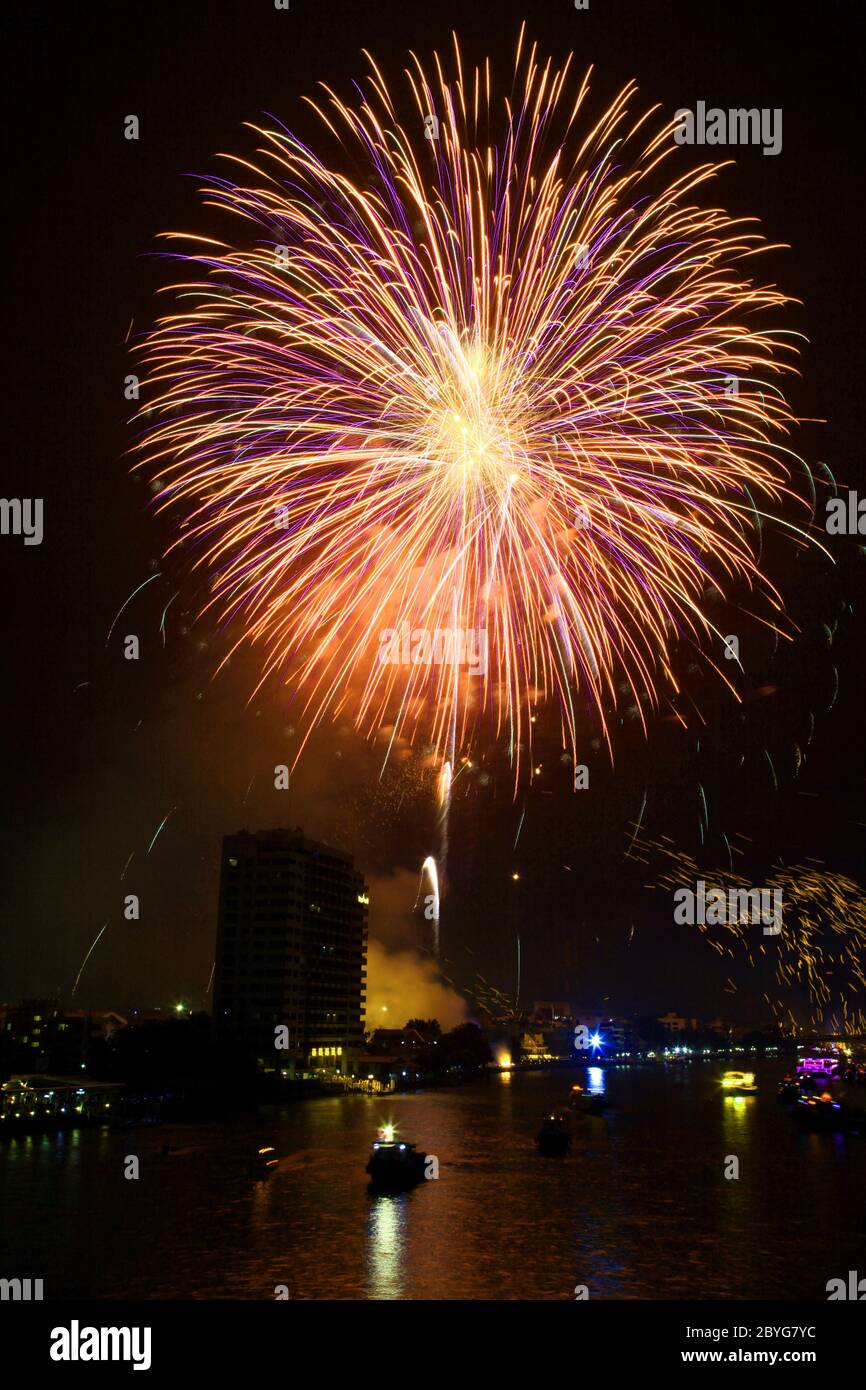 Yellow and violet firework over Chaophraya river Bangkok on Father's ...