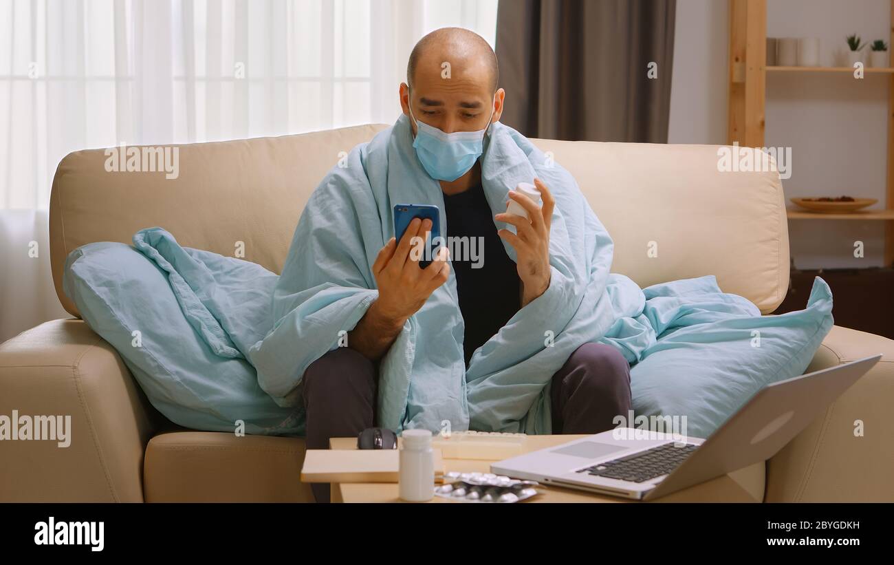 Sick man on a video call with doctor during covid isolation, talking ...