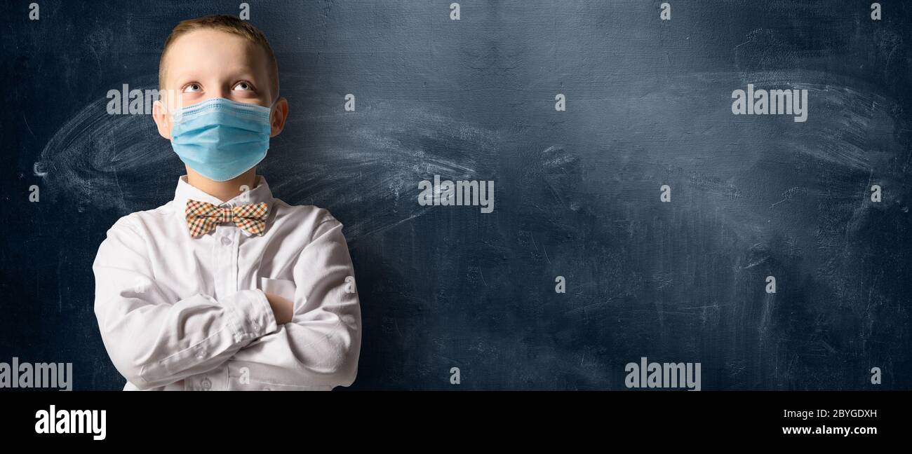 Happy school boy in mask Stock Photo - Alamy