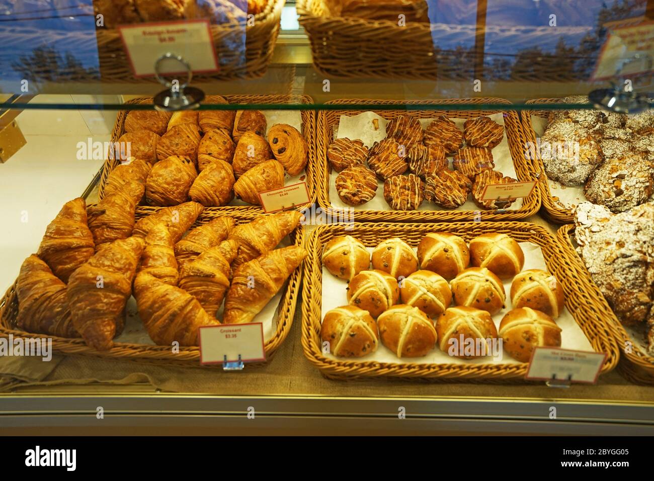 Baskets of butter Almond chocolate croissant, Hot cross bun, Ham and ...
