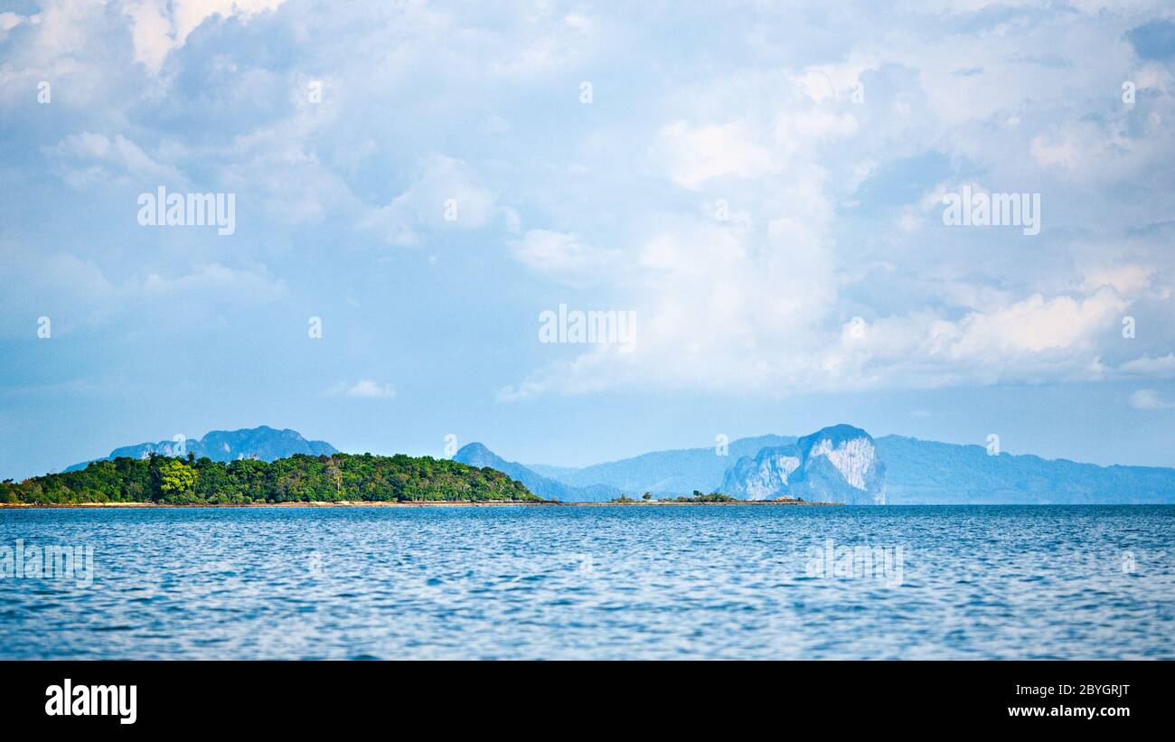 Rocky cliff calm sea hi-res stock photography and images - Alamy