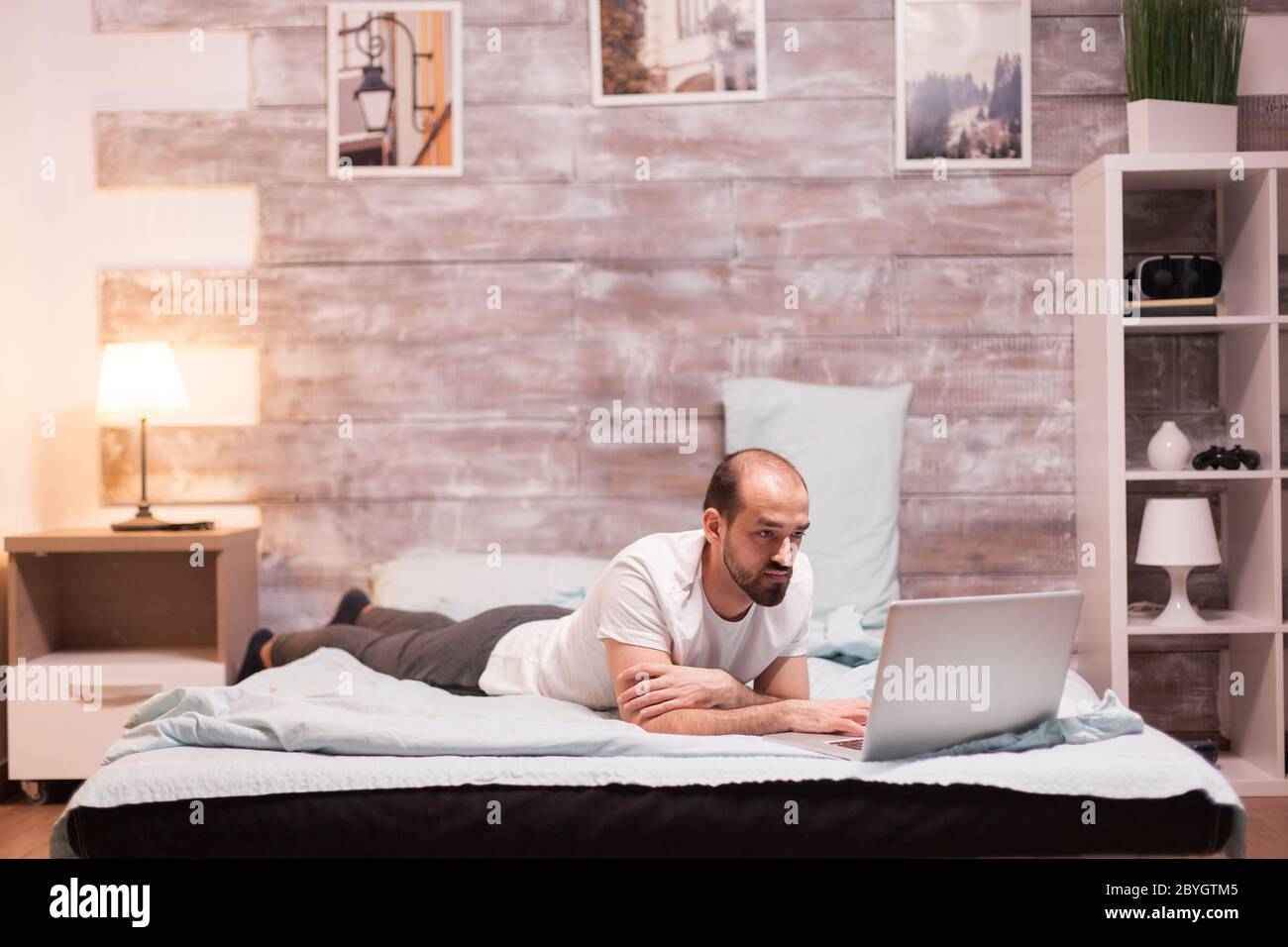 Laptop at night in bed hi-res stock photography and images - Alamy