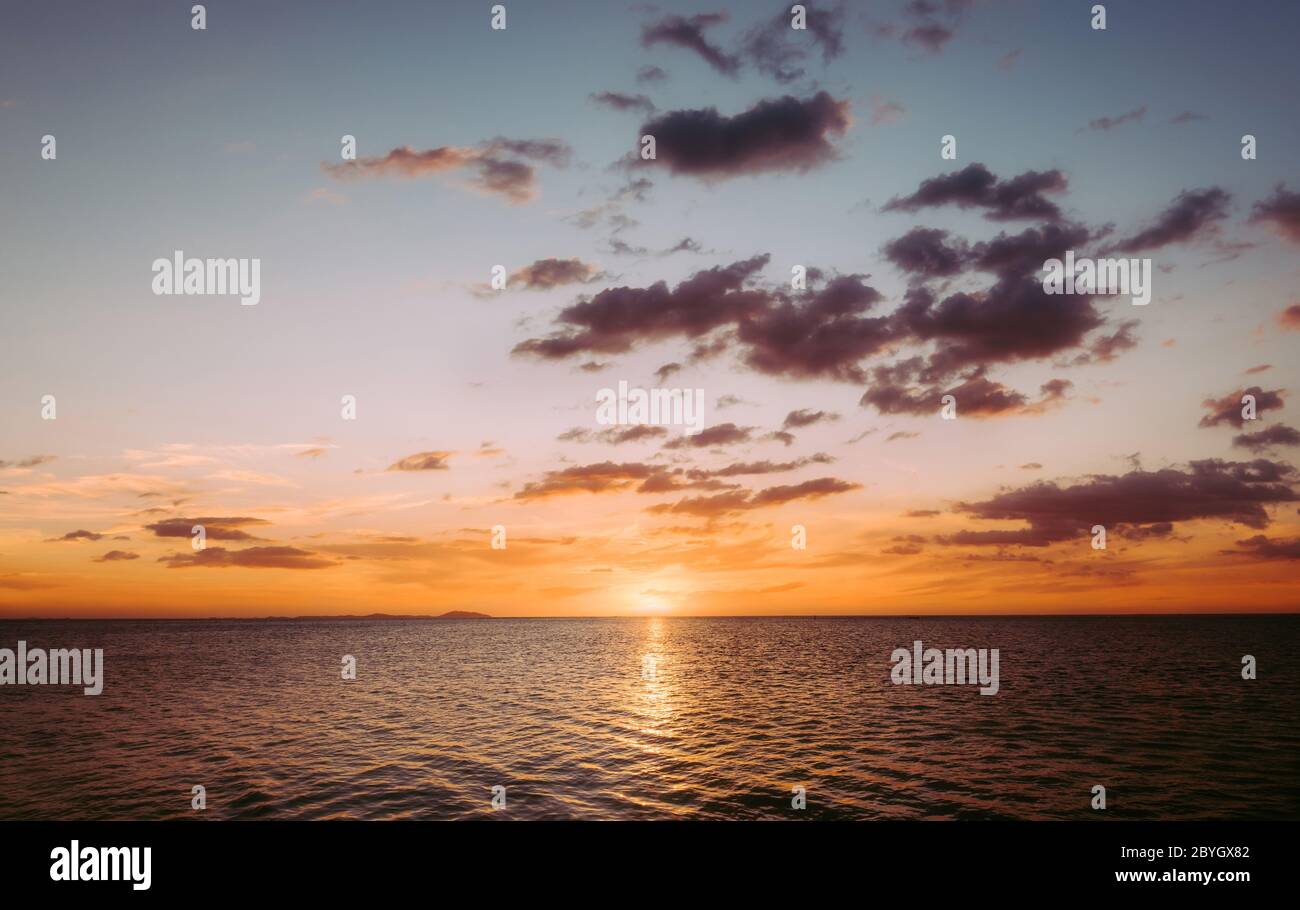 Midsummer beautiful sunset and sunrise sky reflection on sea ocean ...