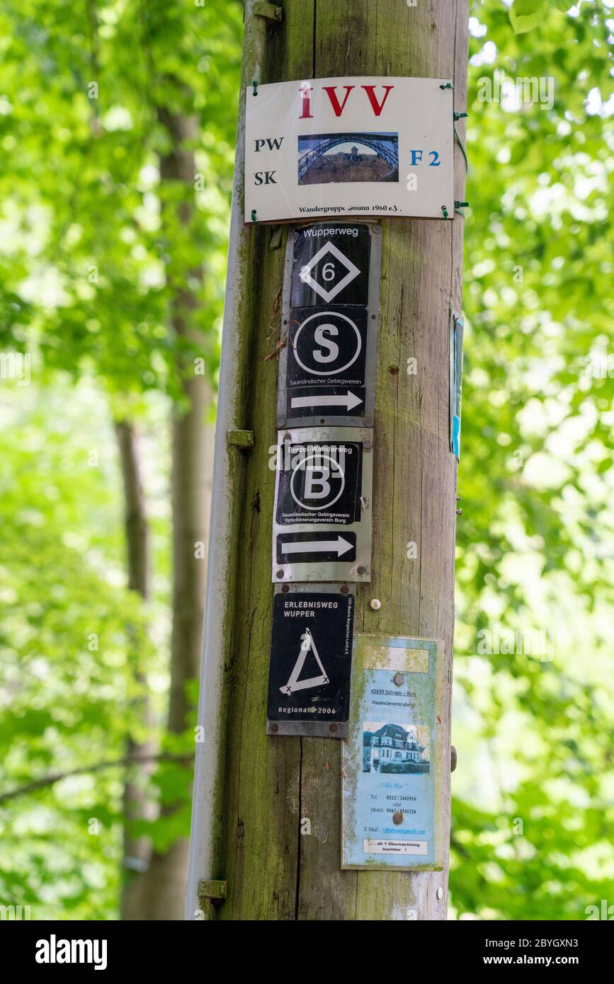Hiking signs in the forest along the river Wupper, near Solingen ...