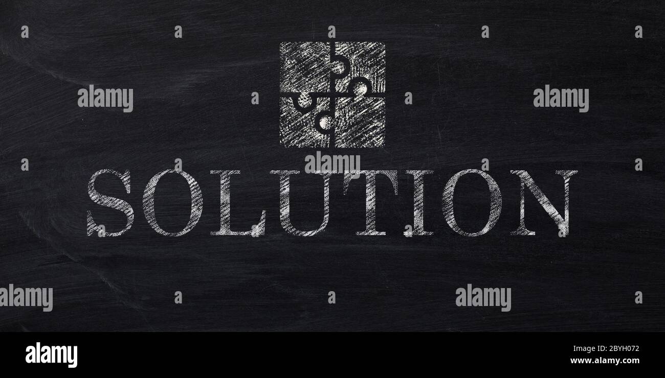 Chalk drawing of puzzle and word SOLUTION on blackboard, creative ...