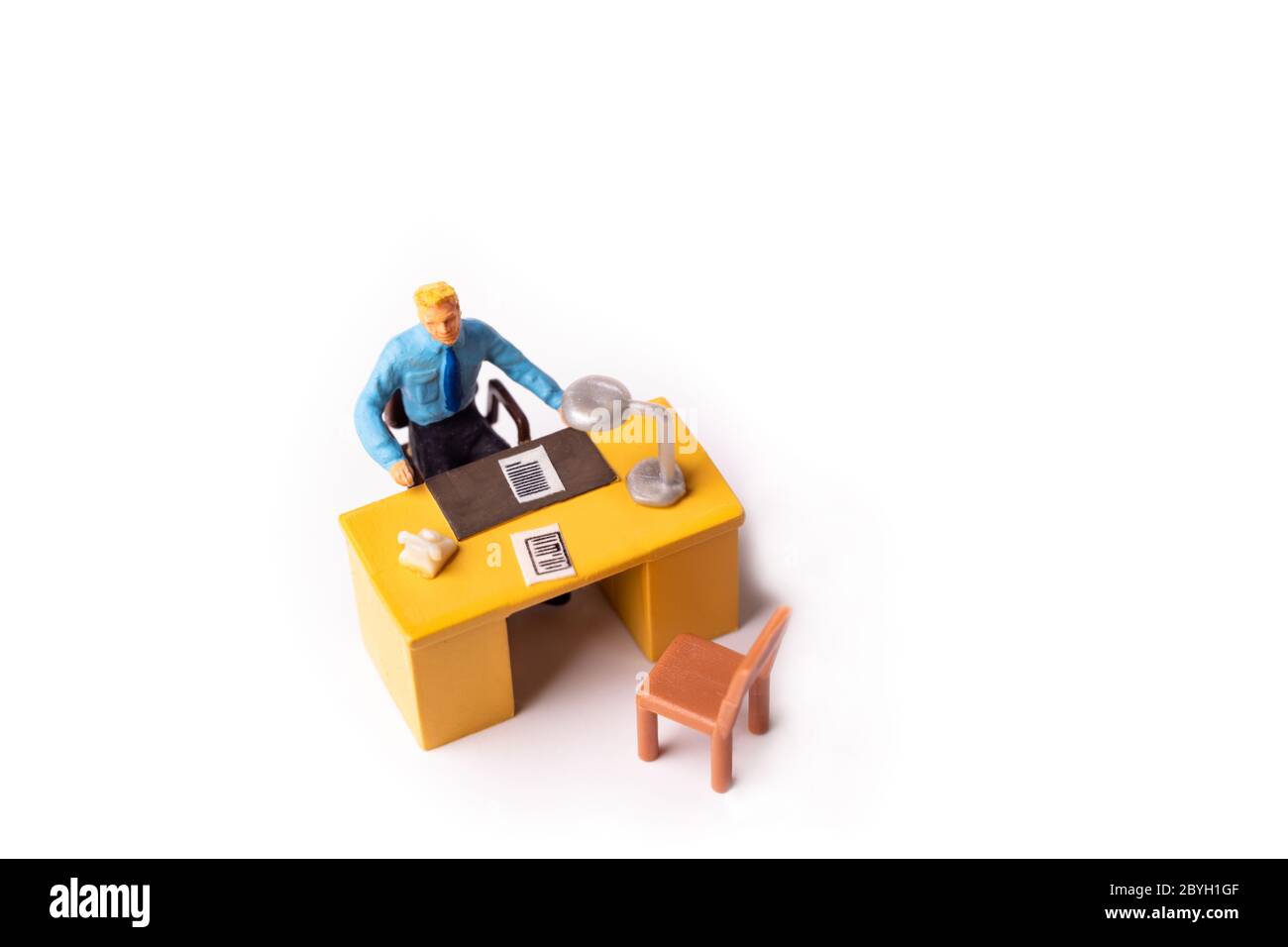 Man suit sitting behind table Cut Out Stock Images & Pictures - Alamy