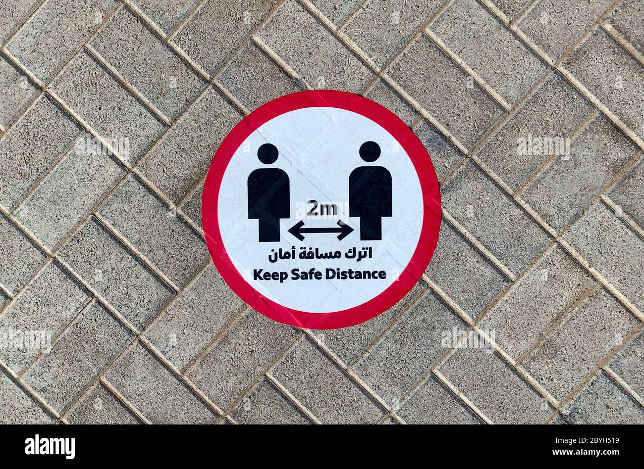 Dubai / UAE - June 10, 2020: "Keep safe distance" sticker sign on a ...