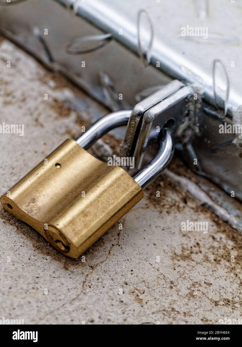A padlock on an iron door - close-up Stock Photo - Alamy