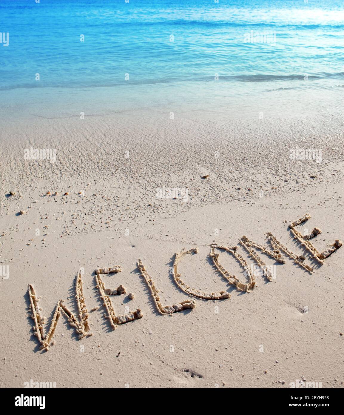 Inscription on sand- Welcome Stock Photo - Alamy