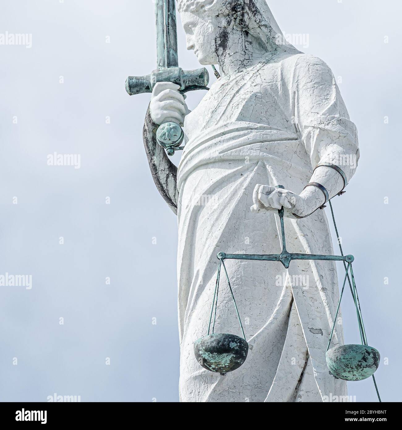Closeup of an ancient statue of goddess Justice with sword and scale at ...