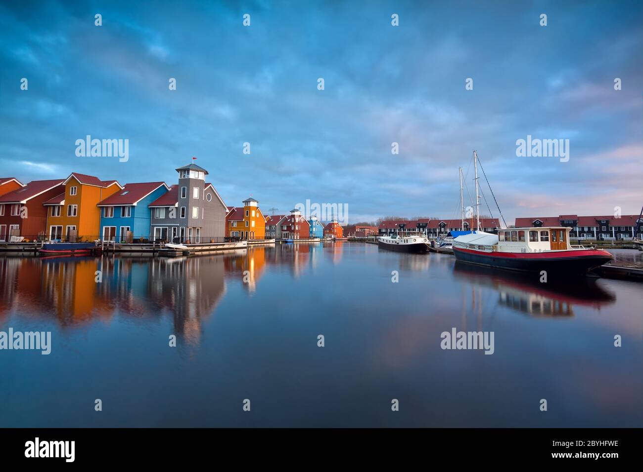 sunrise over colorful buildings and boats in Groni Stock Photo - Alamy