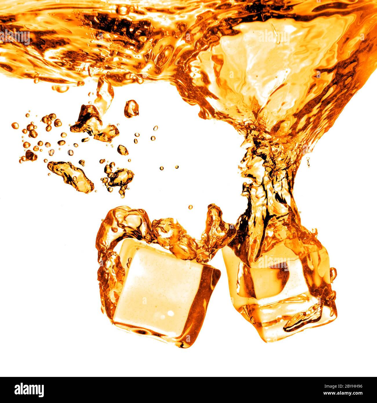 ice cubes dropped into orange water with splash isolated on white Stock ...