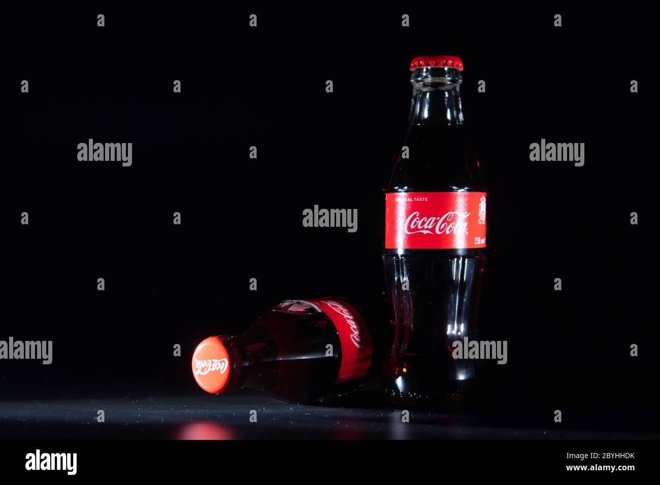 Lviv, Ukraine - May 21, 2020: two glass bottle of coca cola at black ...