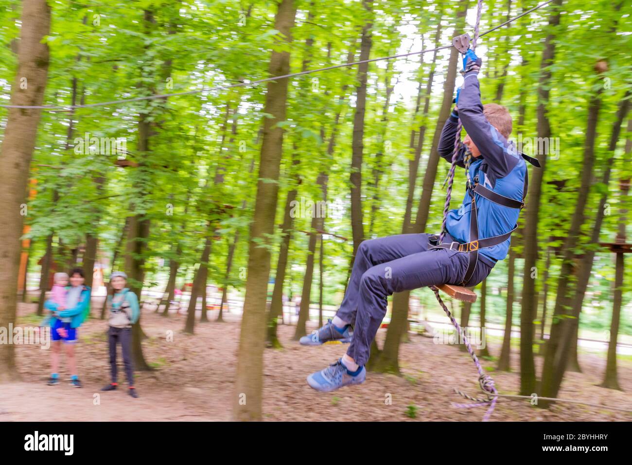 man at rope park in forest Stock Photo - Alamy