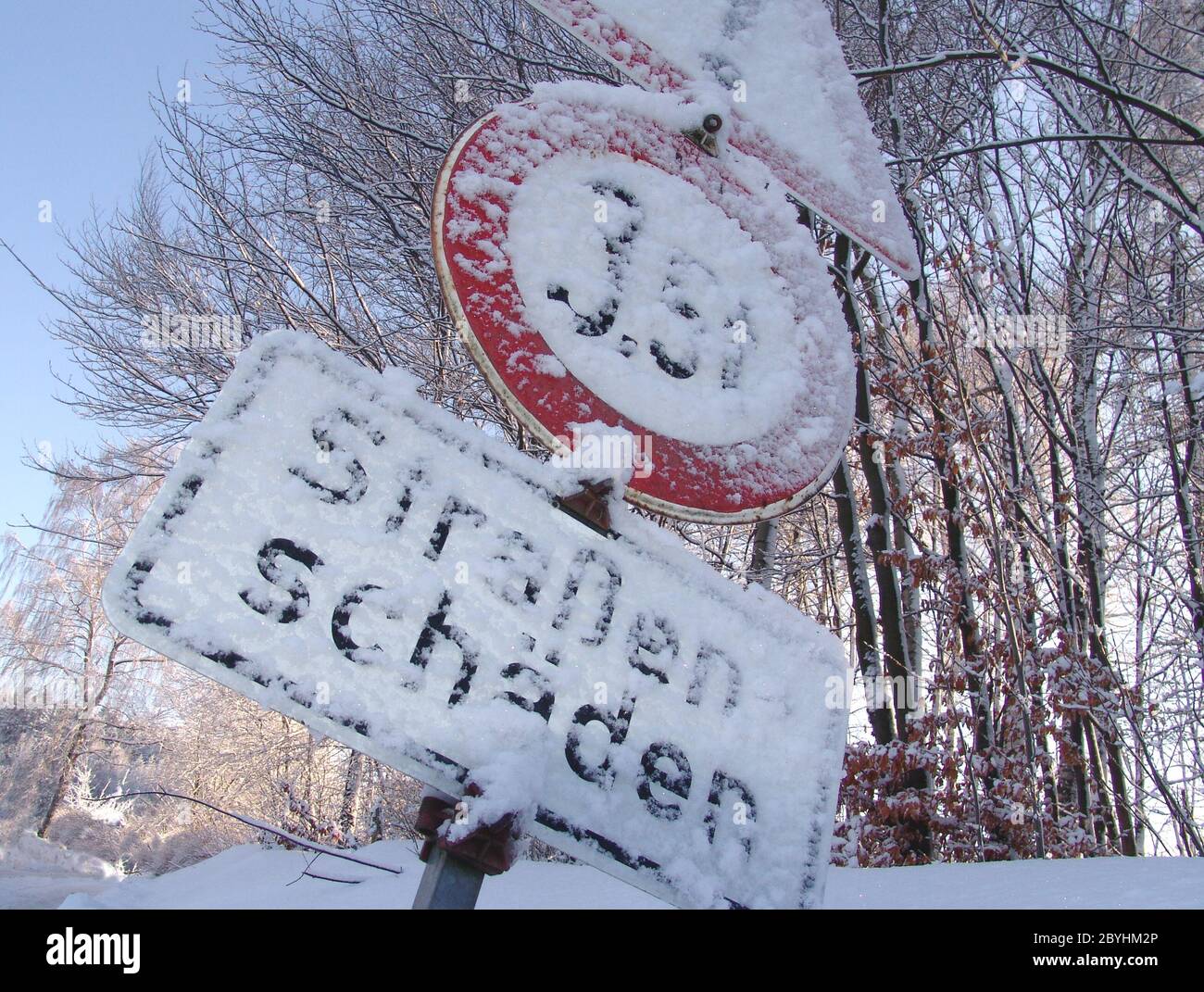 Traffic signs after a snow storm Stock Photo - Alamy