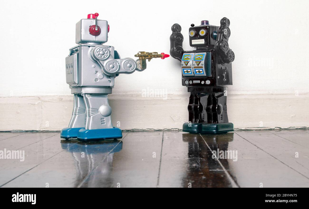 retro robots watch the TV News police brutality Stock Photo - Alamy