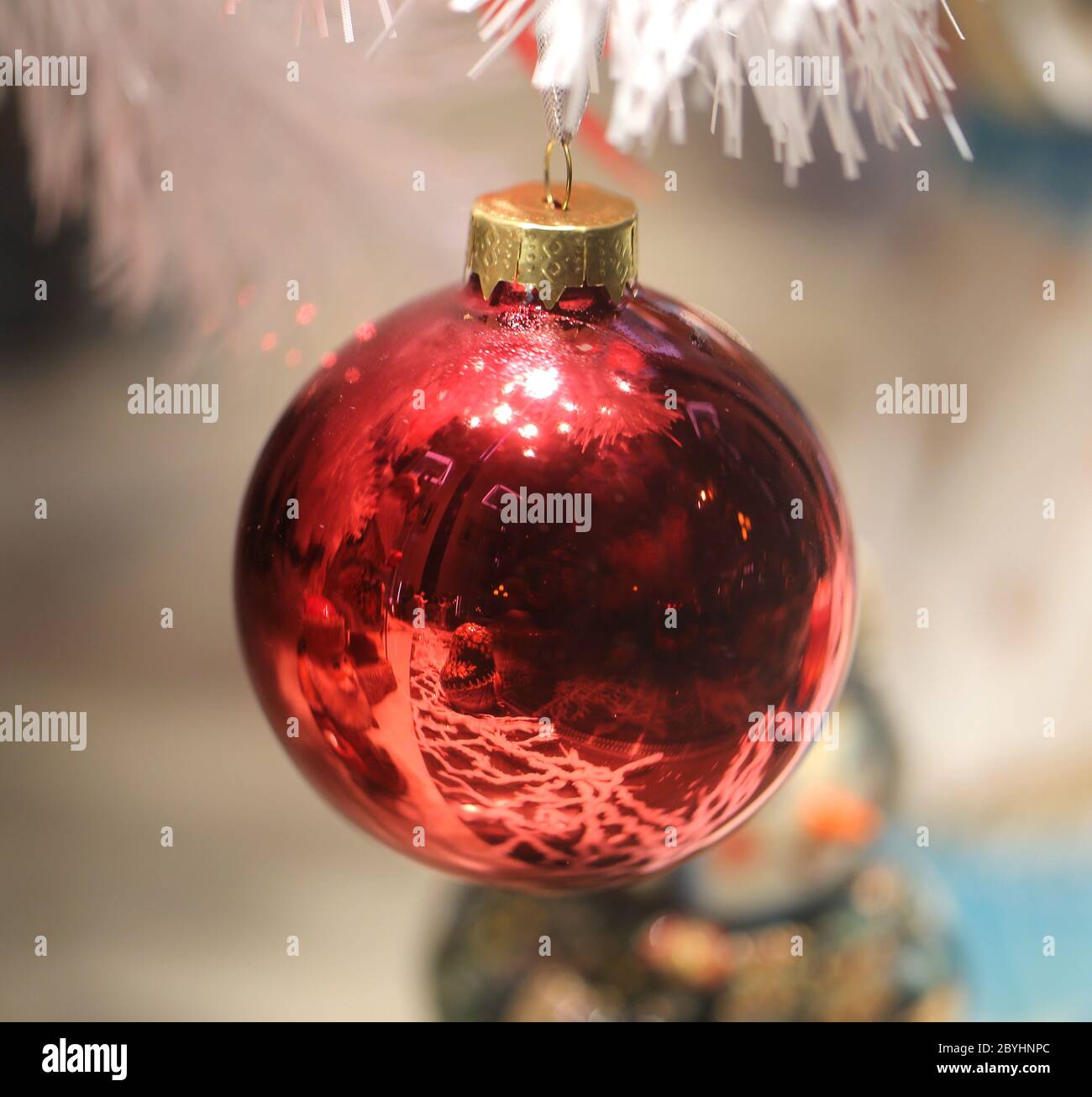 Red ball on Christmas tree Stock Photo - Alamy