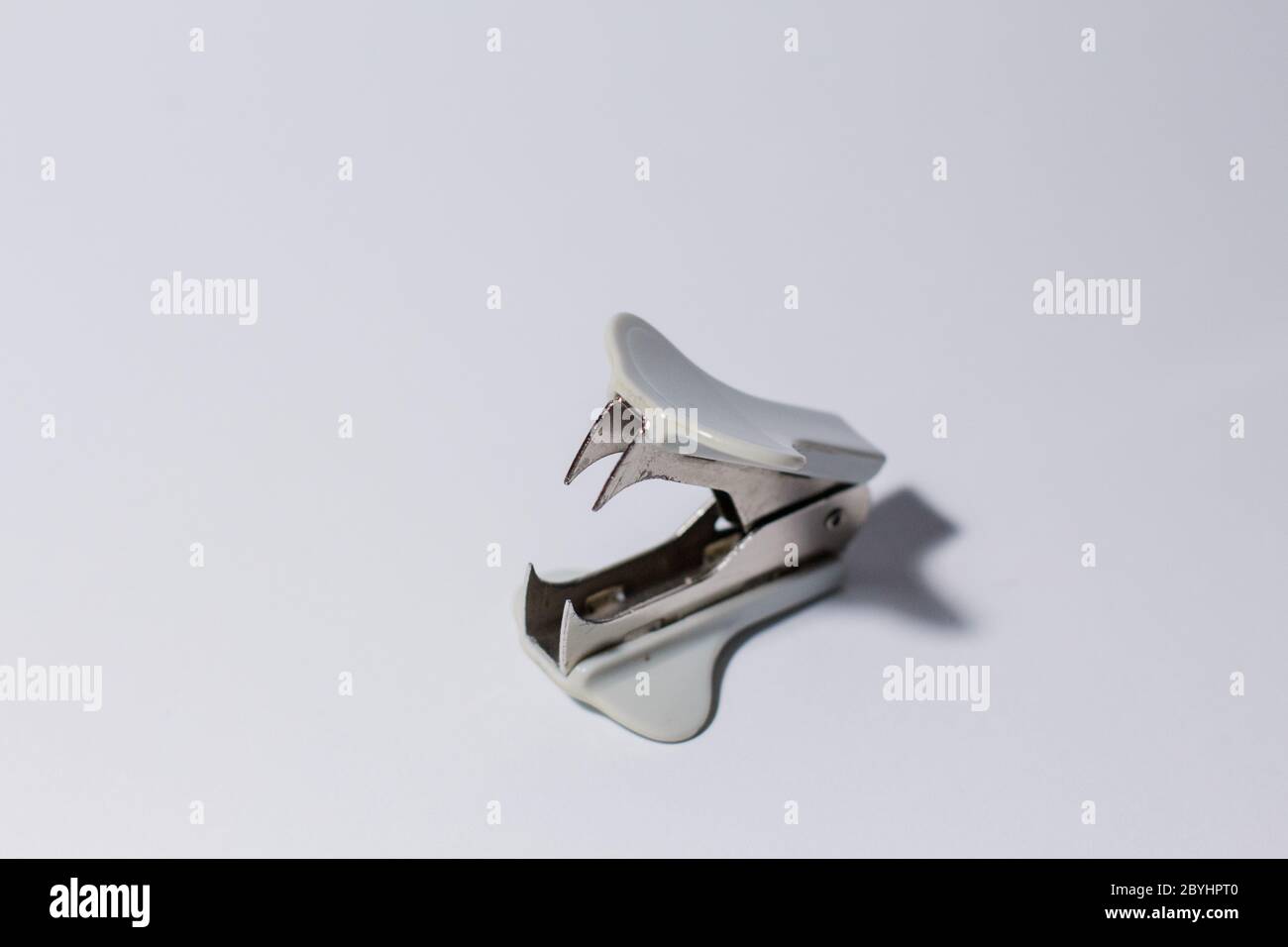 an anti-stapler on a white background Stock Photo - Alamy