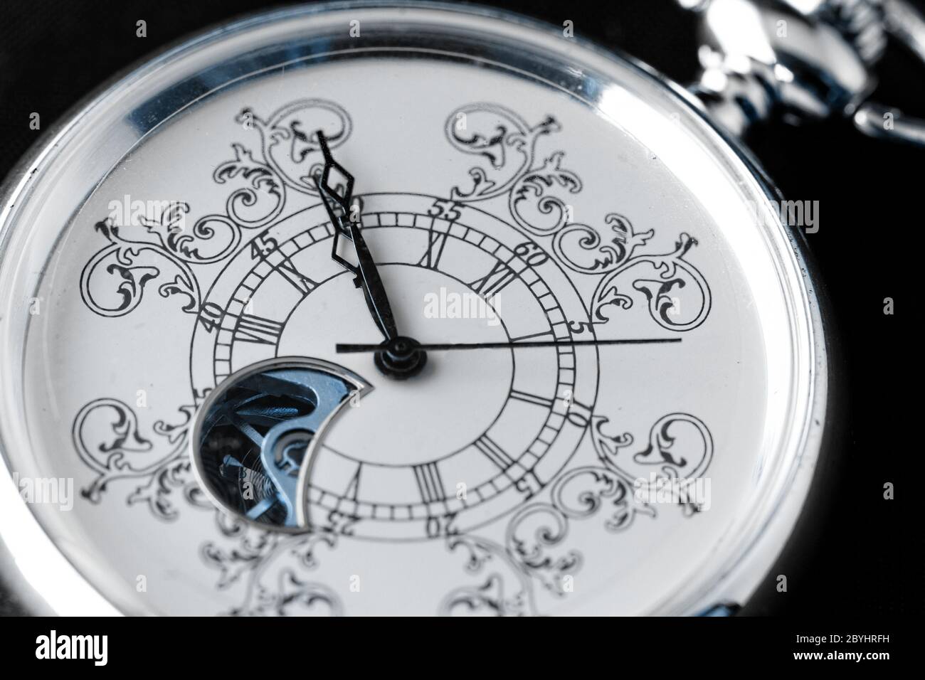 Old watch machine on dark background - blue color Stock Photo - Alamy