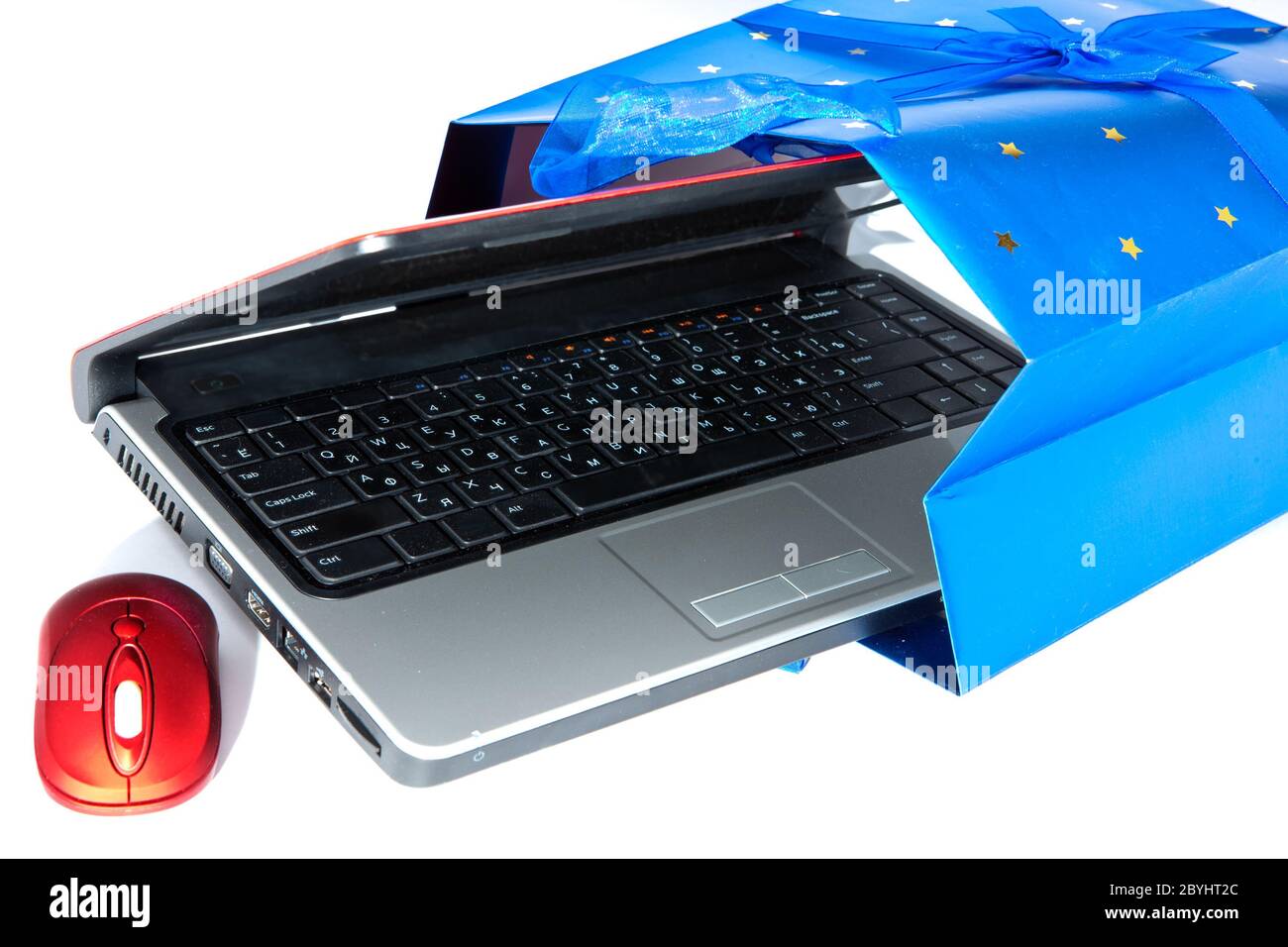 Red notebook and a computer mouse are packed into Stock Photo - Alamy