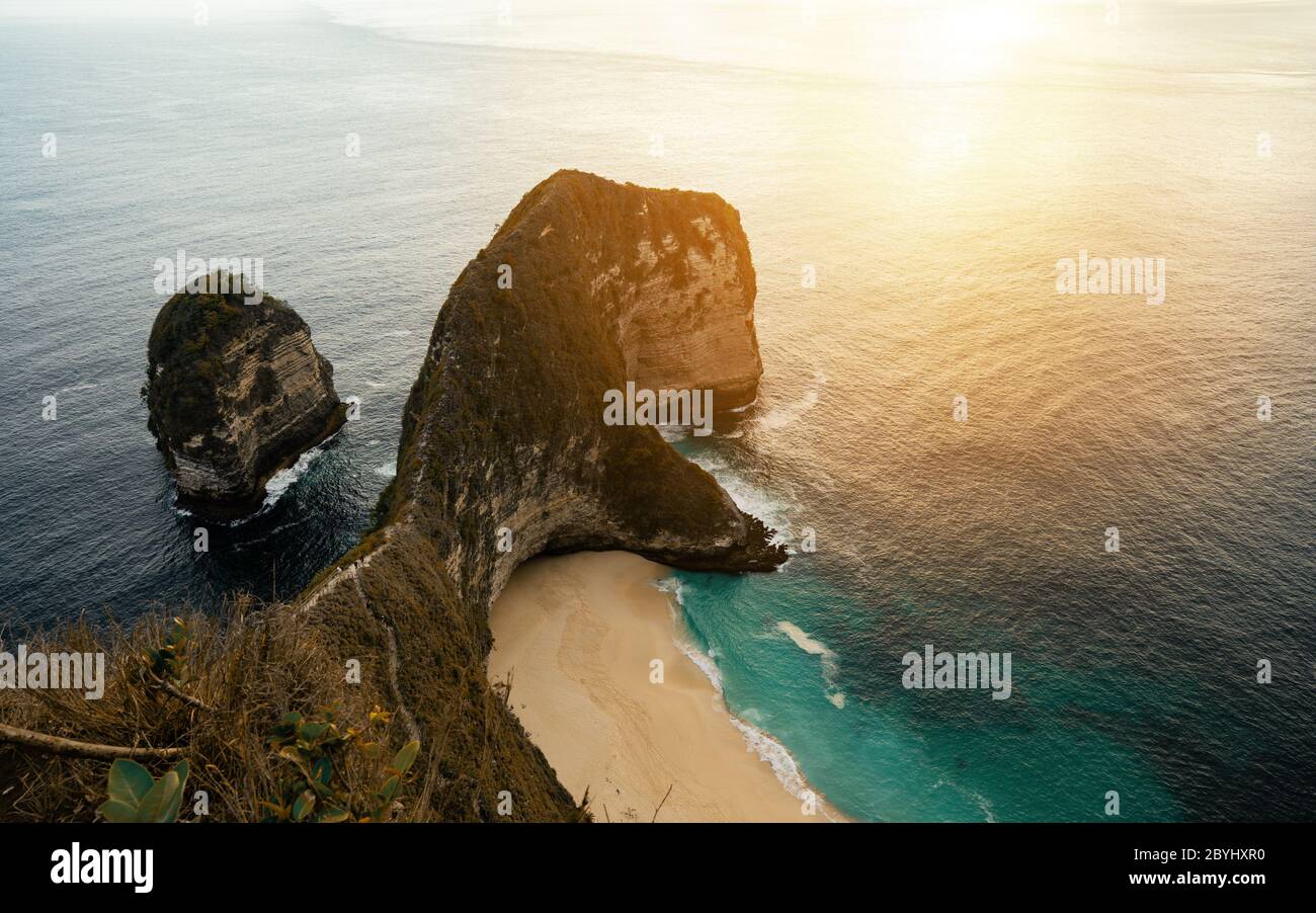 View of Kelingking beach at sunset from the upper vantage point or t ...