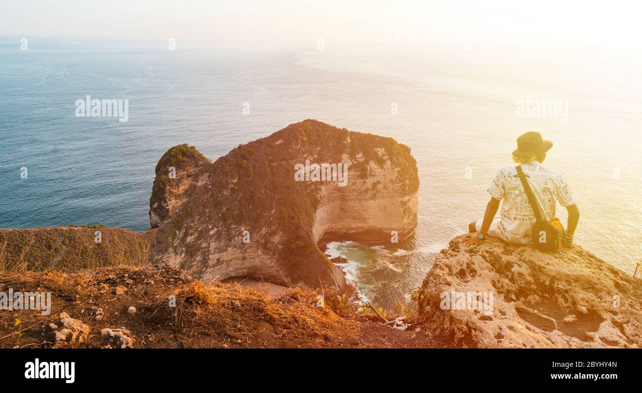 View of Kelingking beach at sunset from the upper vantage point or t ...