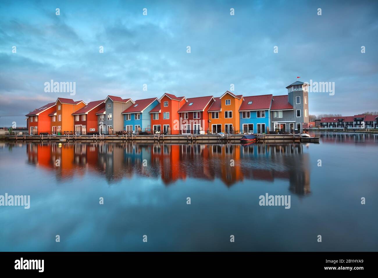 colorful buildings on water at sunrise Stock Photo - Alamy