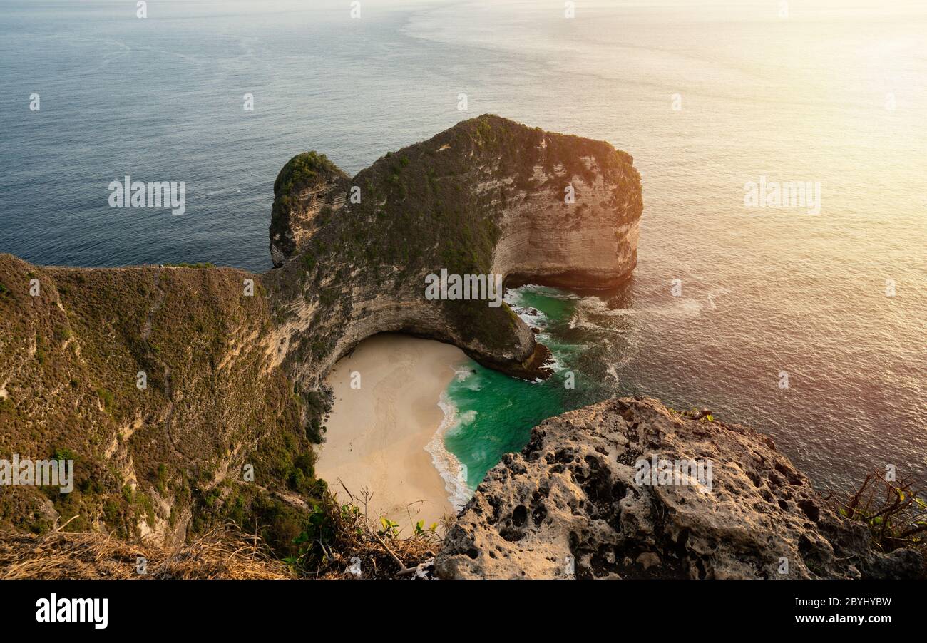 View of Kelingking beach at sunset from the upper vantage point or t ...