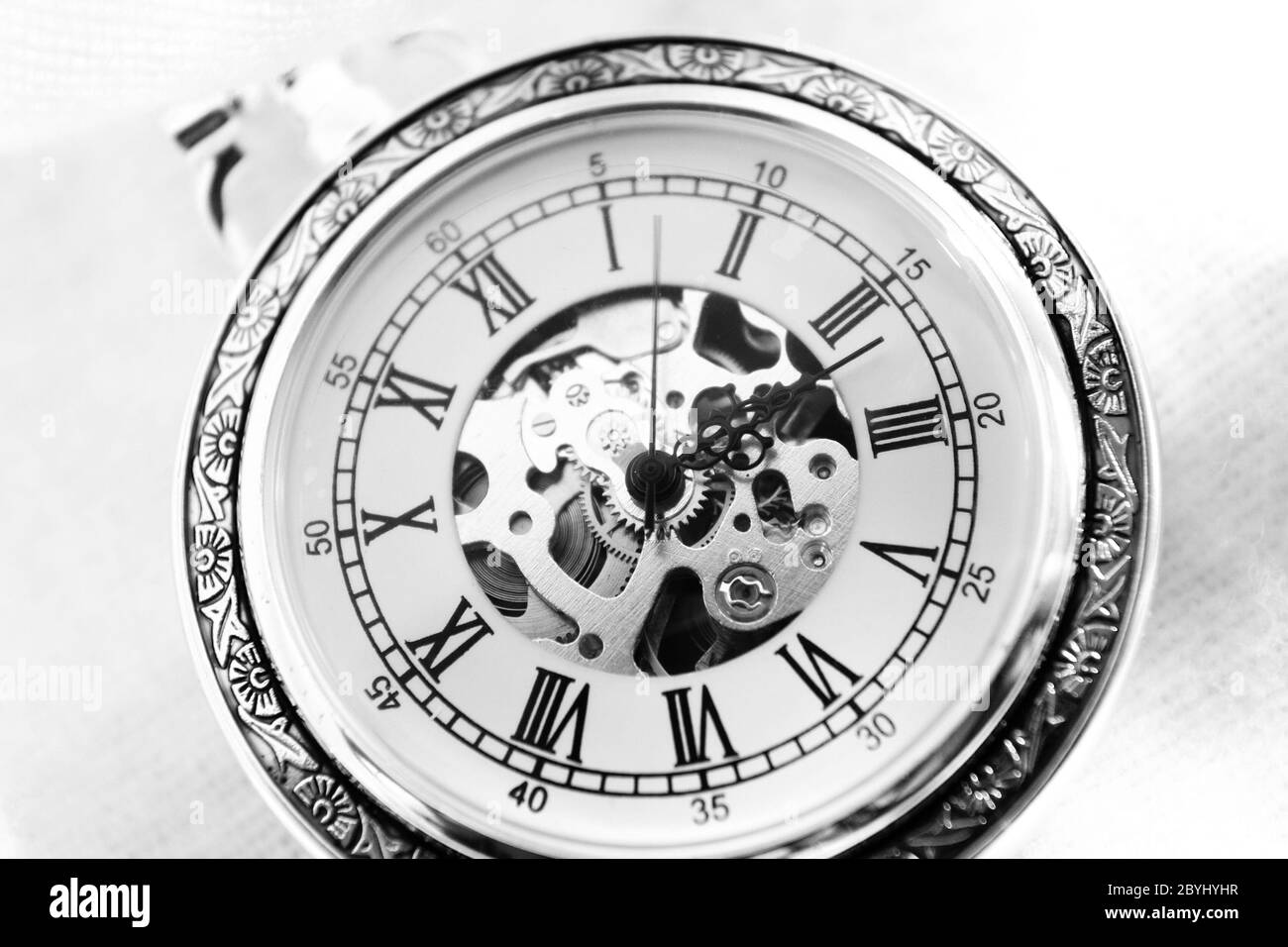 Old watch machine on white background Stock Photo - Alamy