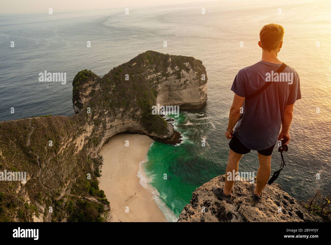 View of Kelingking beach at sunset from the upper vantage point or t ...