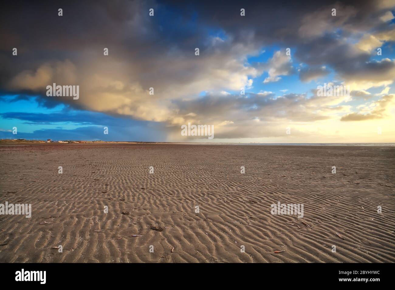 sunset sky over sand beach Stock Photo - Alamy