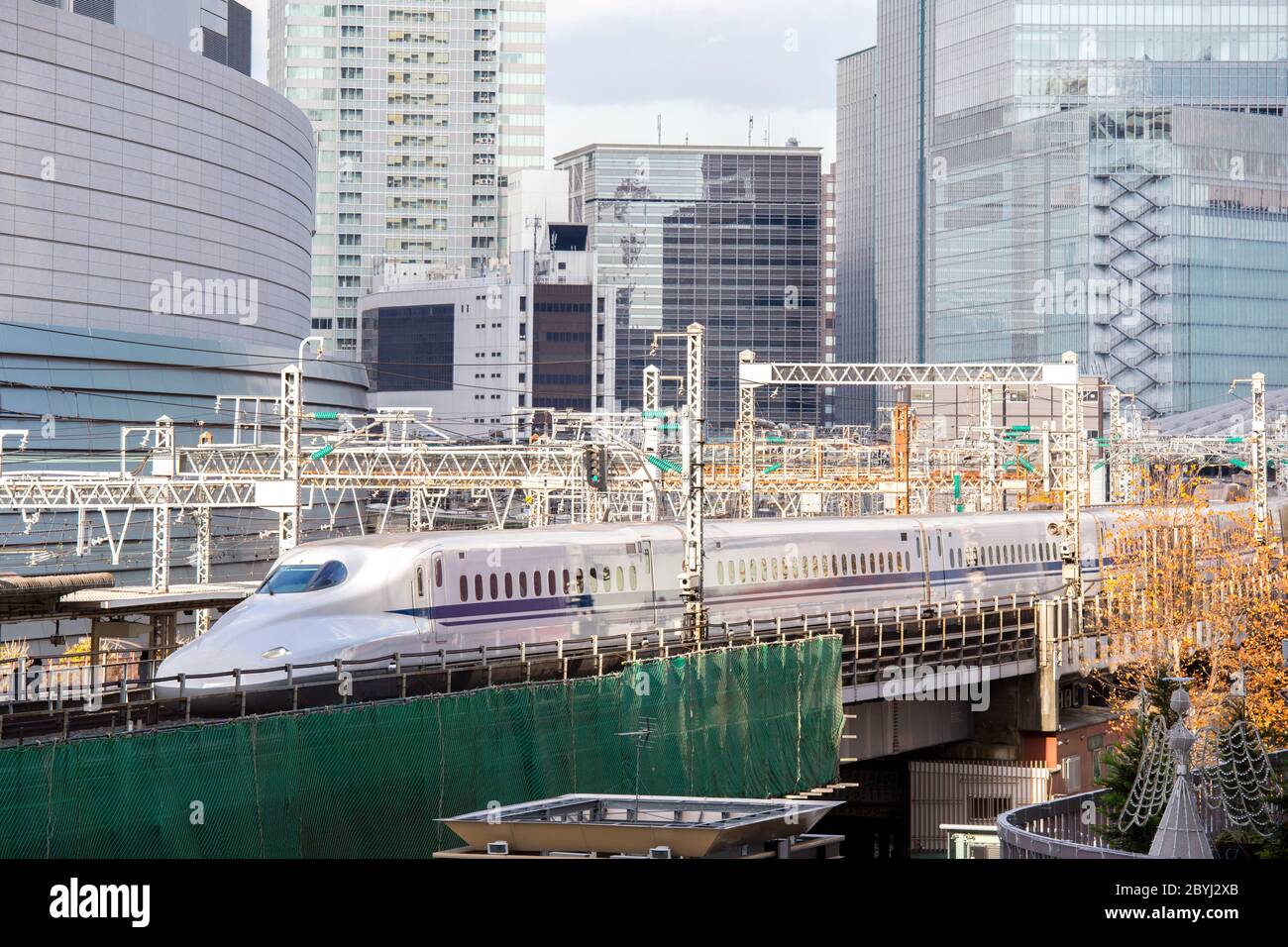 Tokyo railway with skyline Stock Photo - Alamy