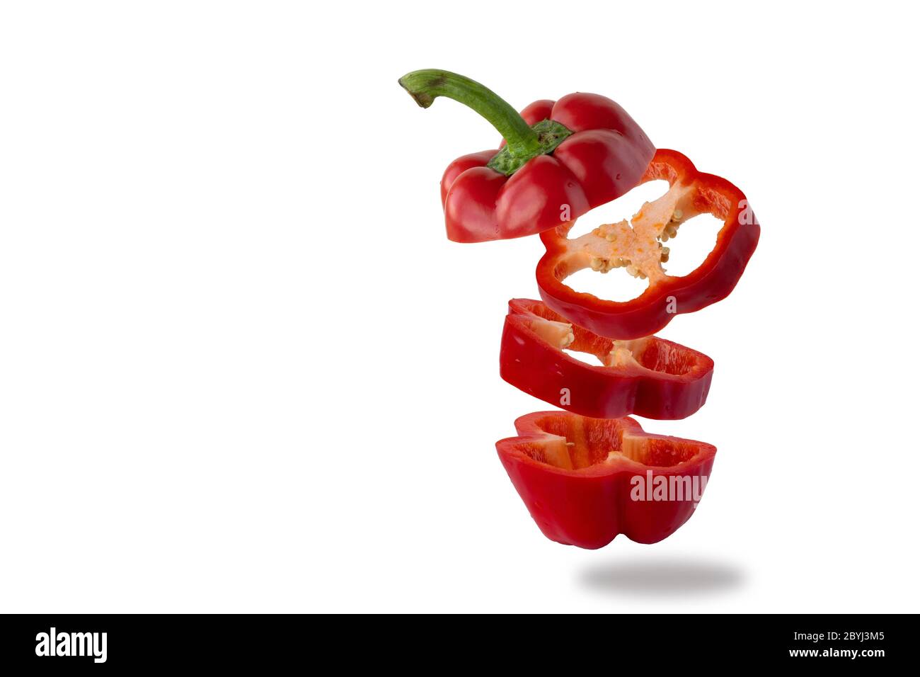 Flying red pepper isolated on white background. Food levitation concept ...