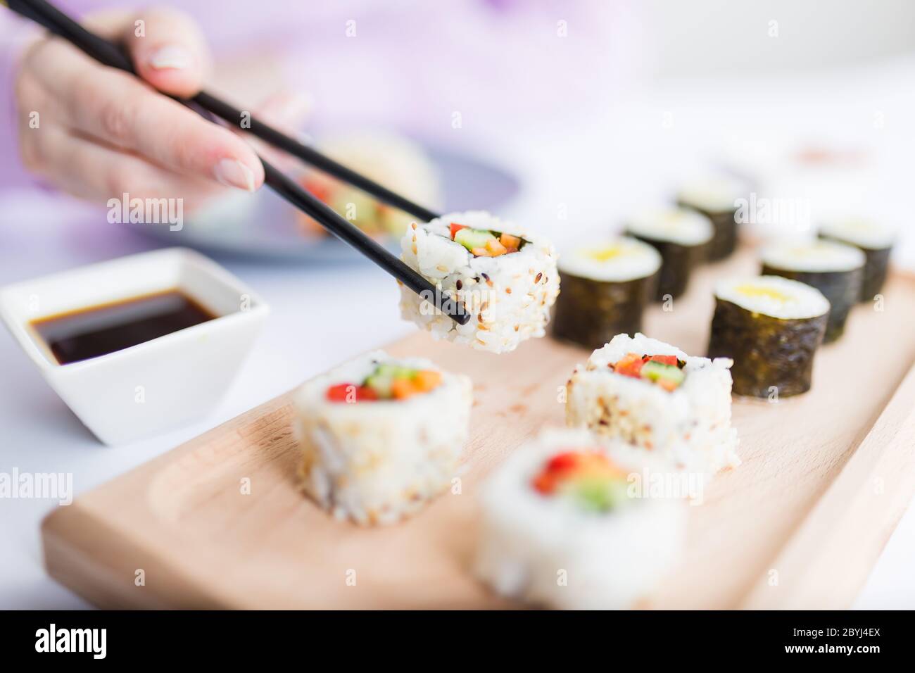 Woman eating rolls sticks hi-res stock photography and images - Alamy