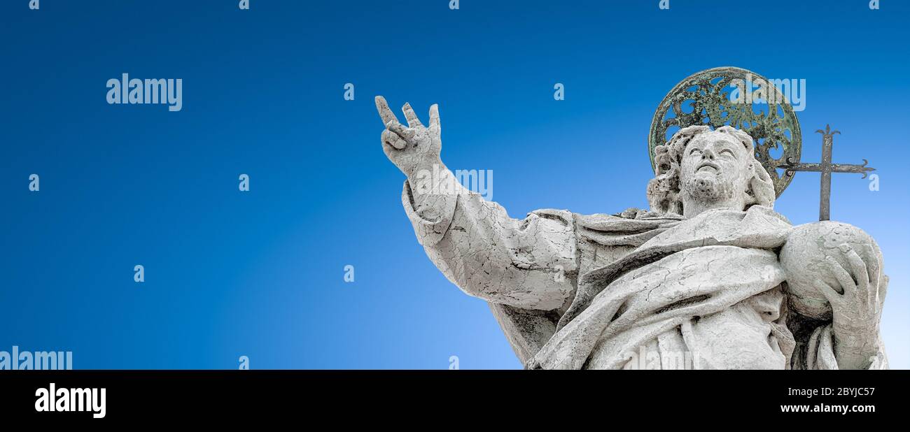 Banner with holly priest with cross and nimbus at the roof of Church of ...