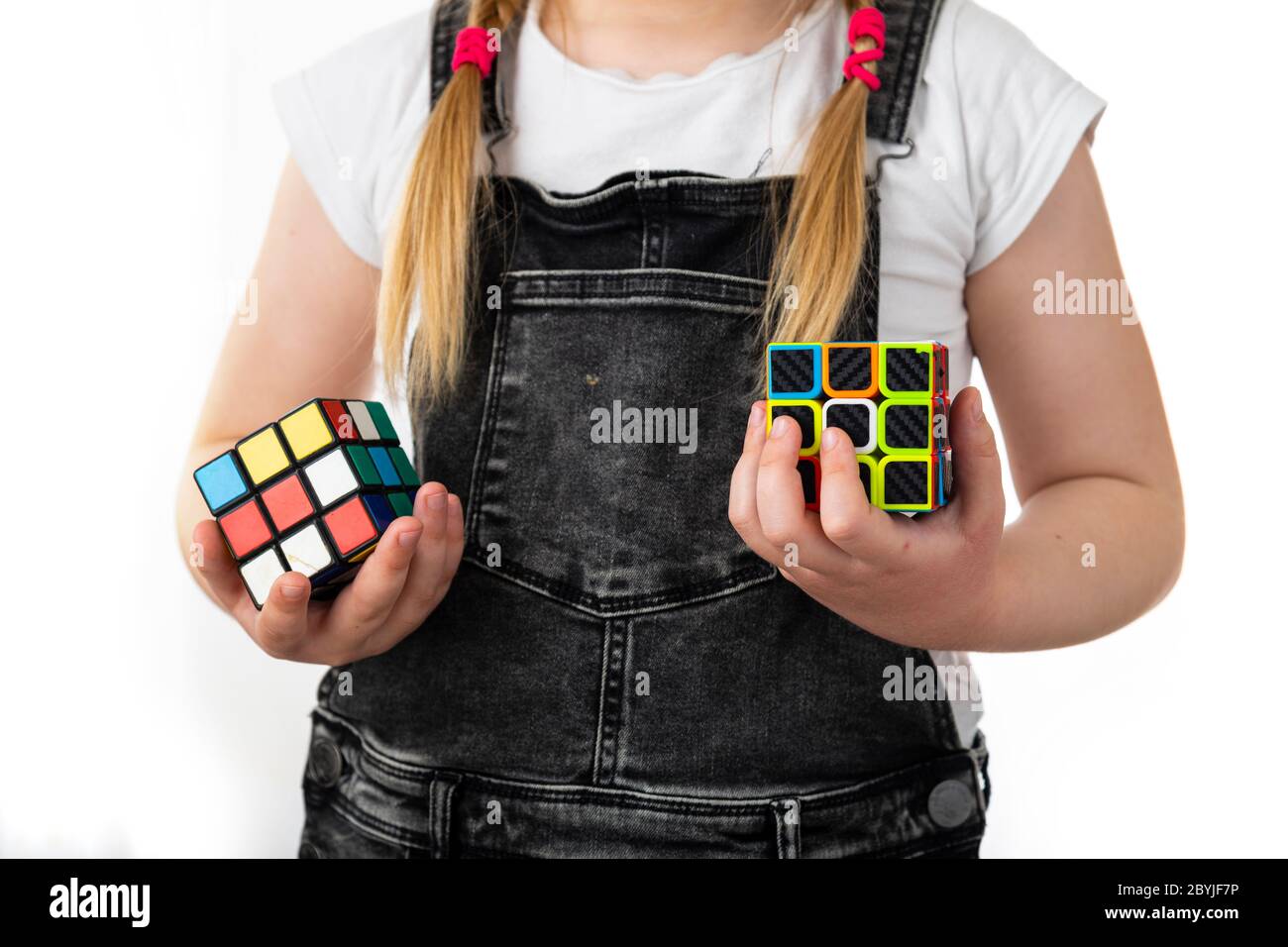 Minsk, Belarus, June 9, 2020: Rubik's cube in the hands of a little ...