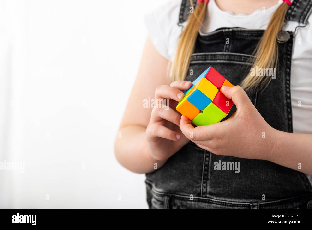 Minsk, Belarus, June 9, 2020: Rubik's cube in the hands of a little ...