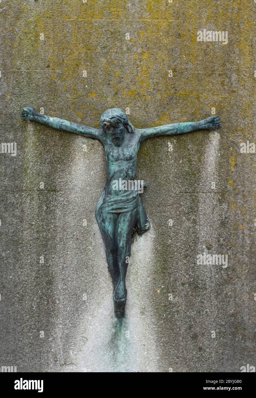 iron effigy of Jesus Christ against a concrete stone completely ...