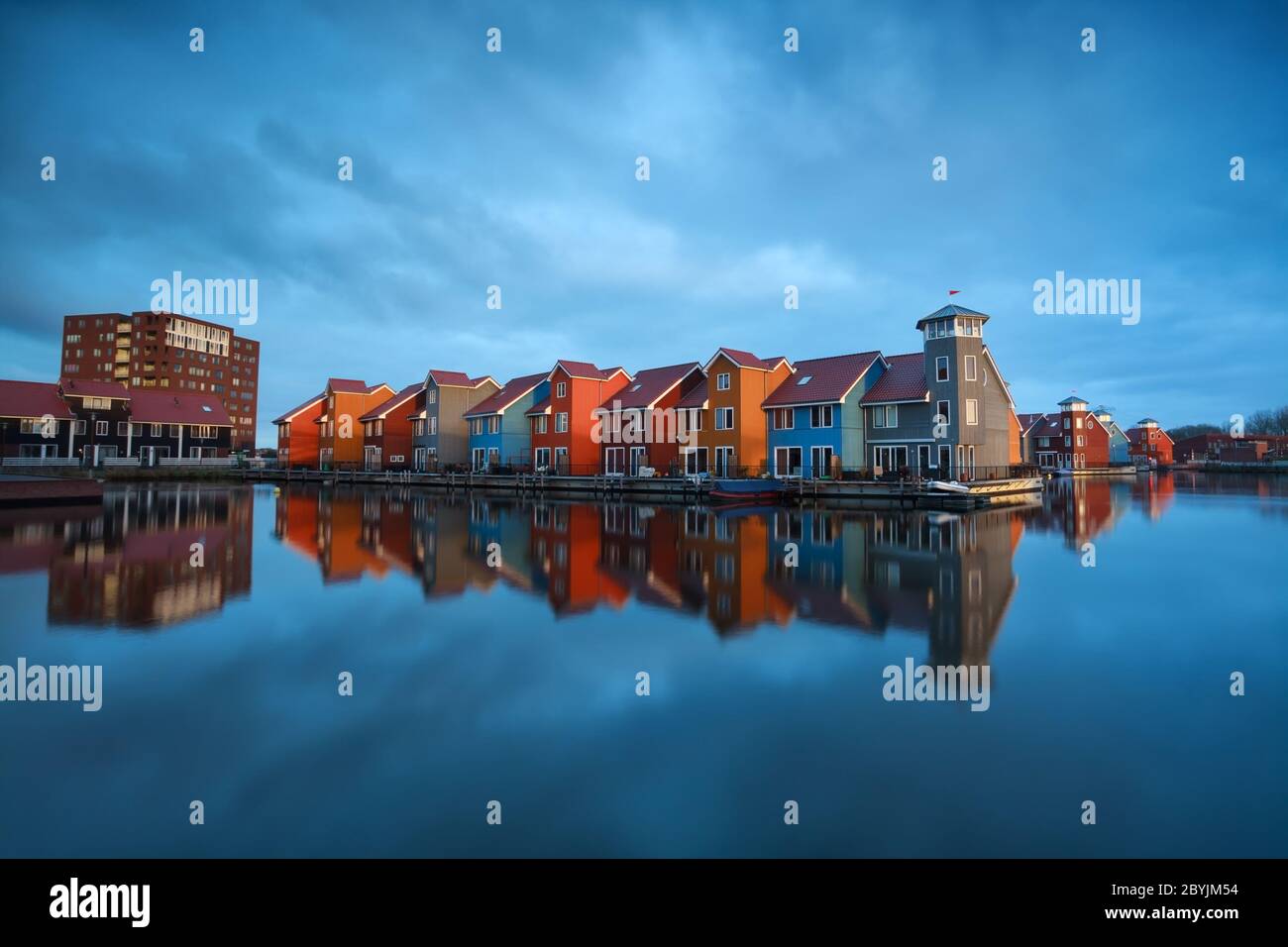 colorful buildings on water in Holland Stock Photo - Alamy