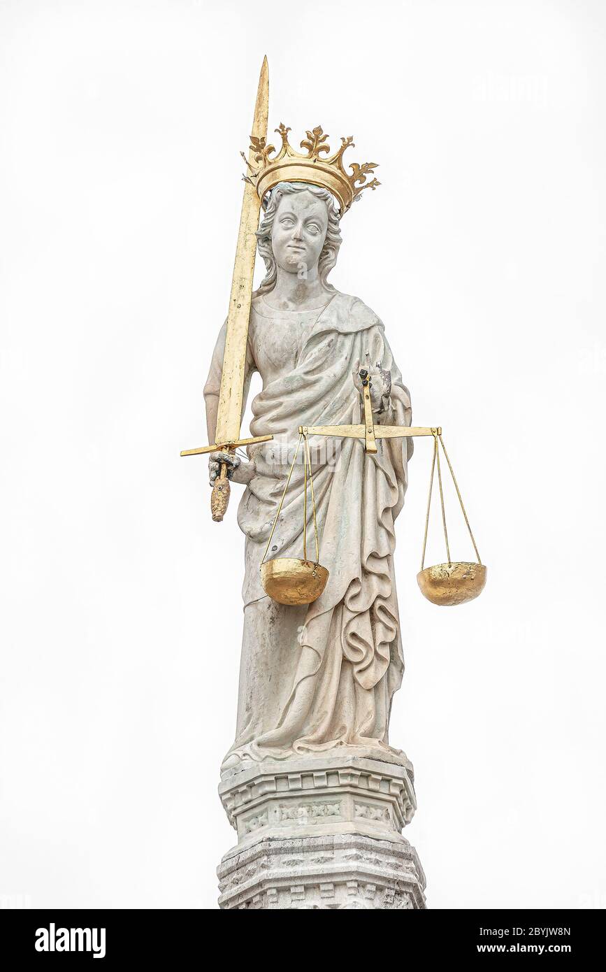Statue of goddess Justice with golden sword and scale isolated at the ...