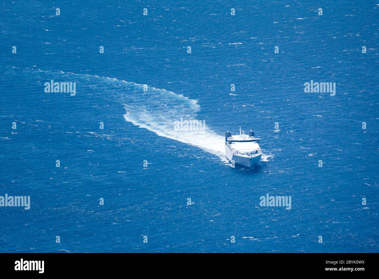 boat in the blue sea Stock Photo - Alamy