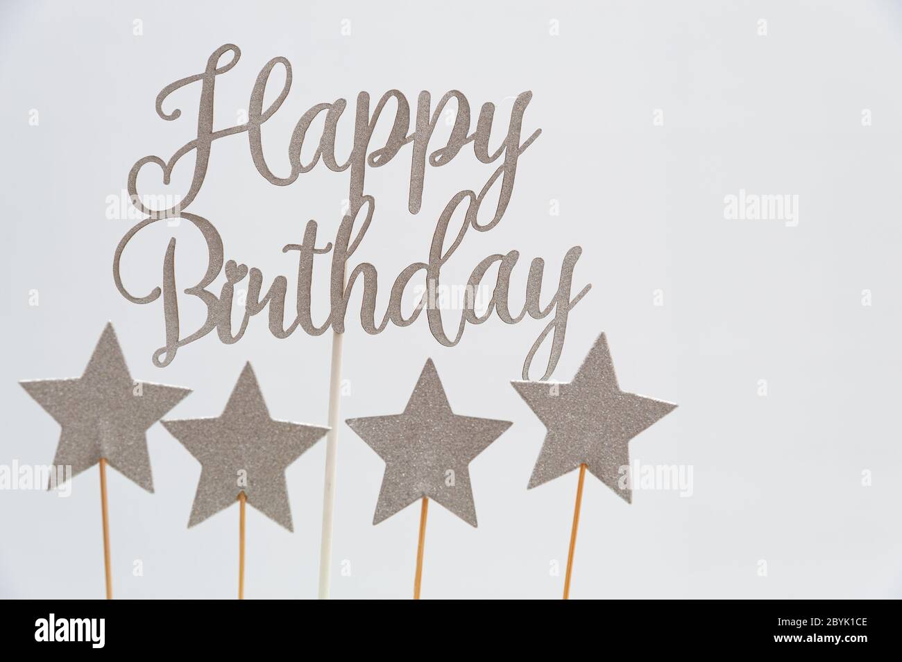 Happy Birthday written in silver letters with star shapes. Isolated on ...