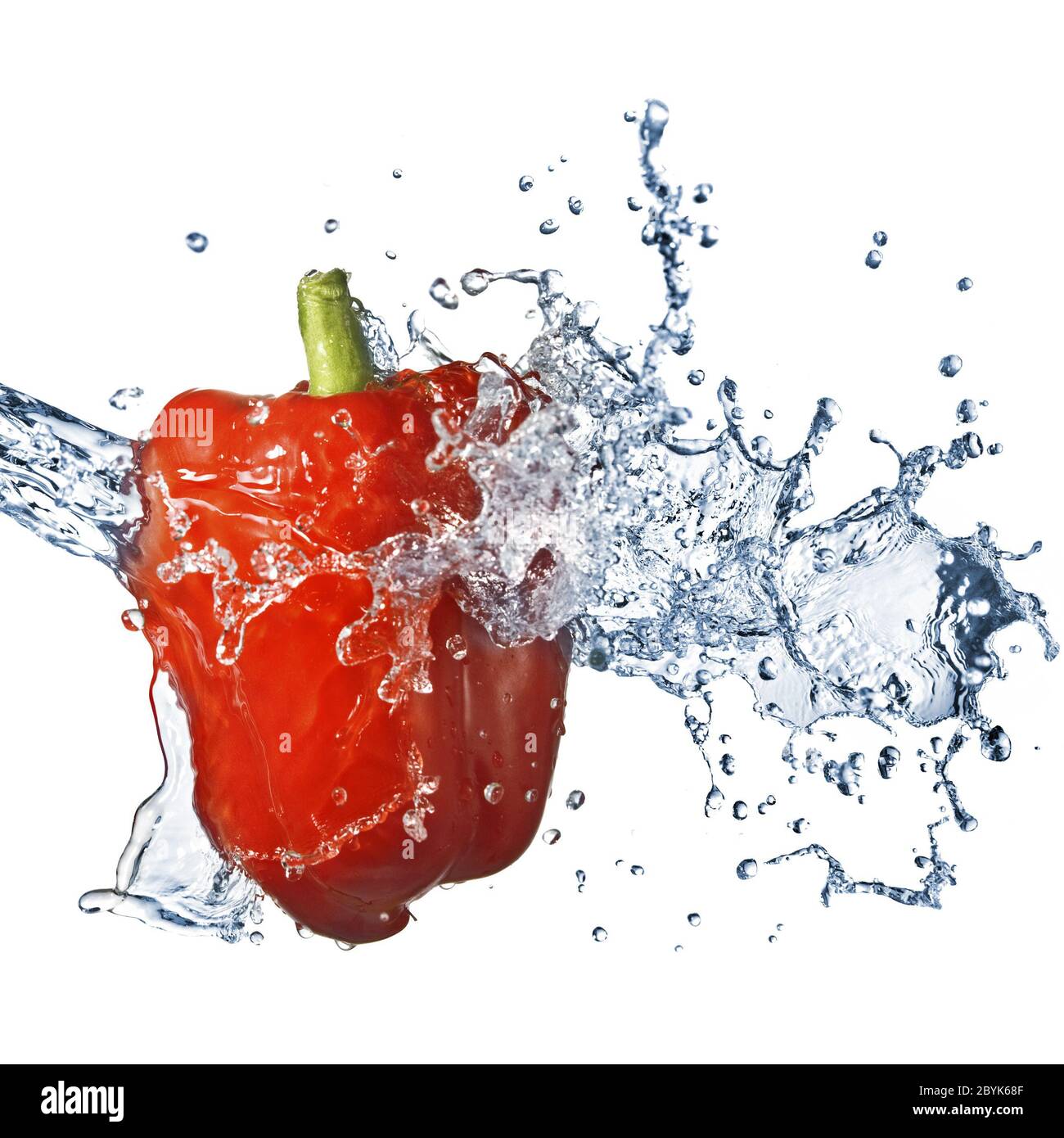 fresh water splash on red pepper isolated on white Stock Photo - Alamy