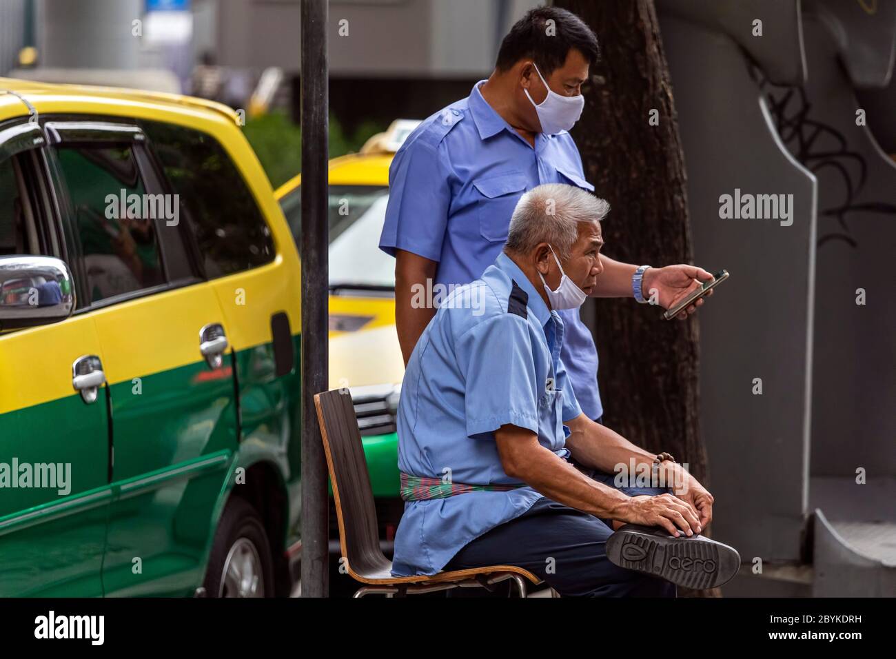 Taxi driver with face mask waiting for customers during Covid pandemic ...