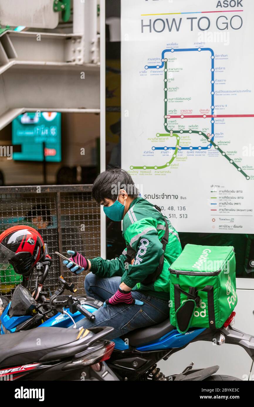 Grab motorcycle rider with face mask during Covid pandemic, Bangkok ...
