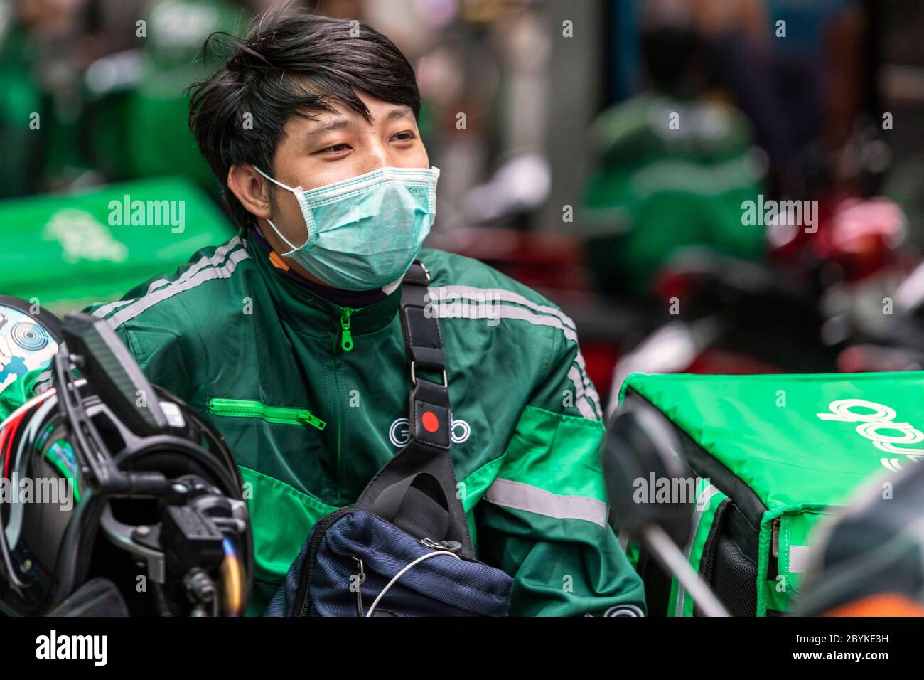 Grab motorcycle rider with face mask during Covid pandemic, Bangkok ...