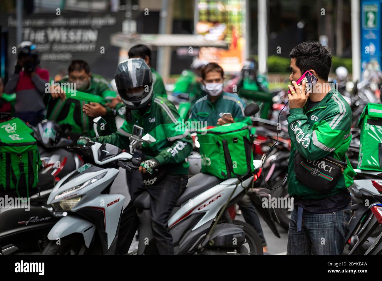 Grab motorcycle riders with face mask during Covid pandemic, Bangkok ...