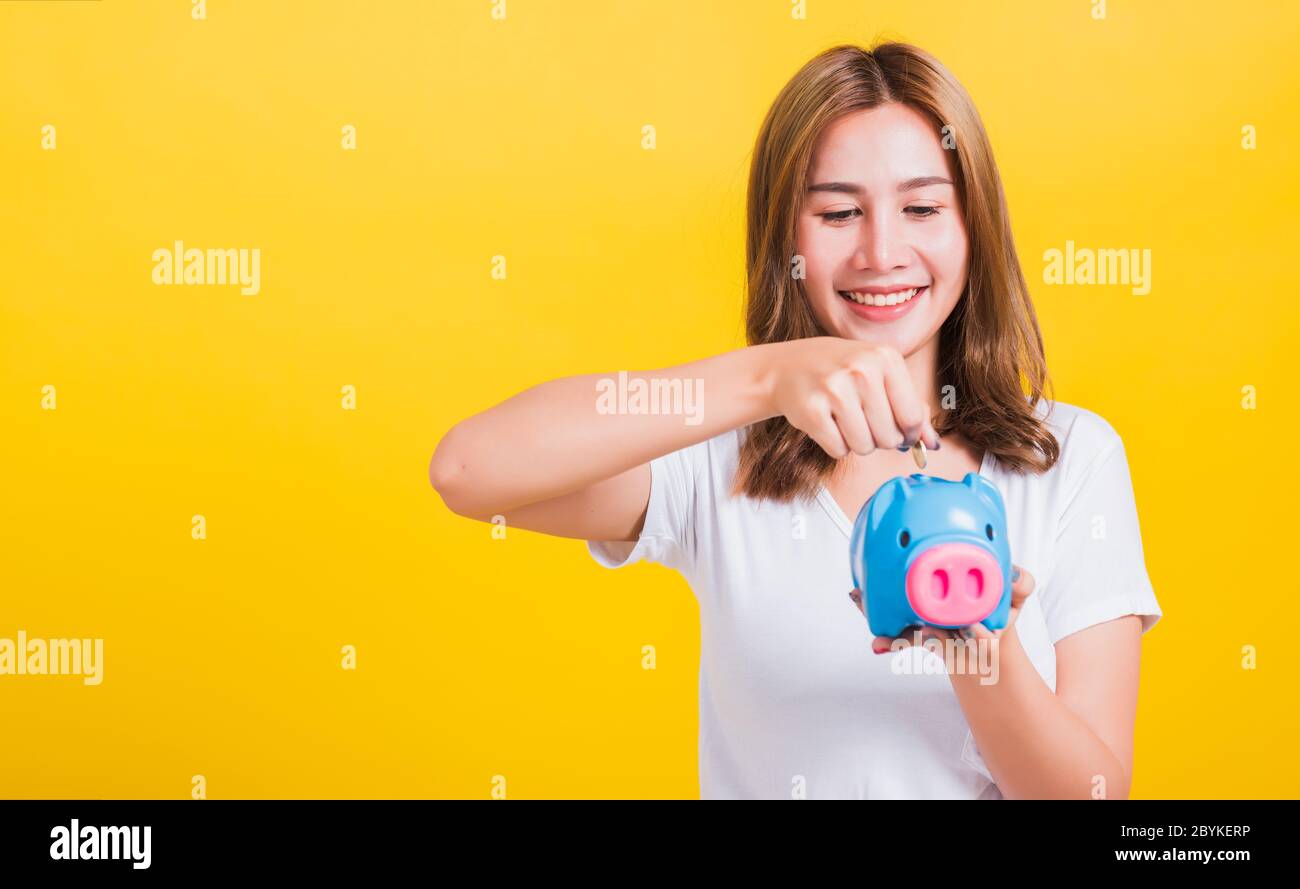 Female hand dropping coin hi-res stock photography and images - Alamy