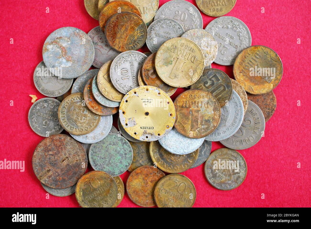 vintage clock on rusty coins on red background,image of a Stock Photo ...