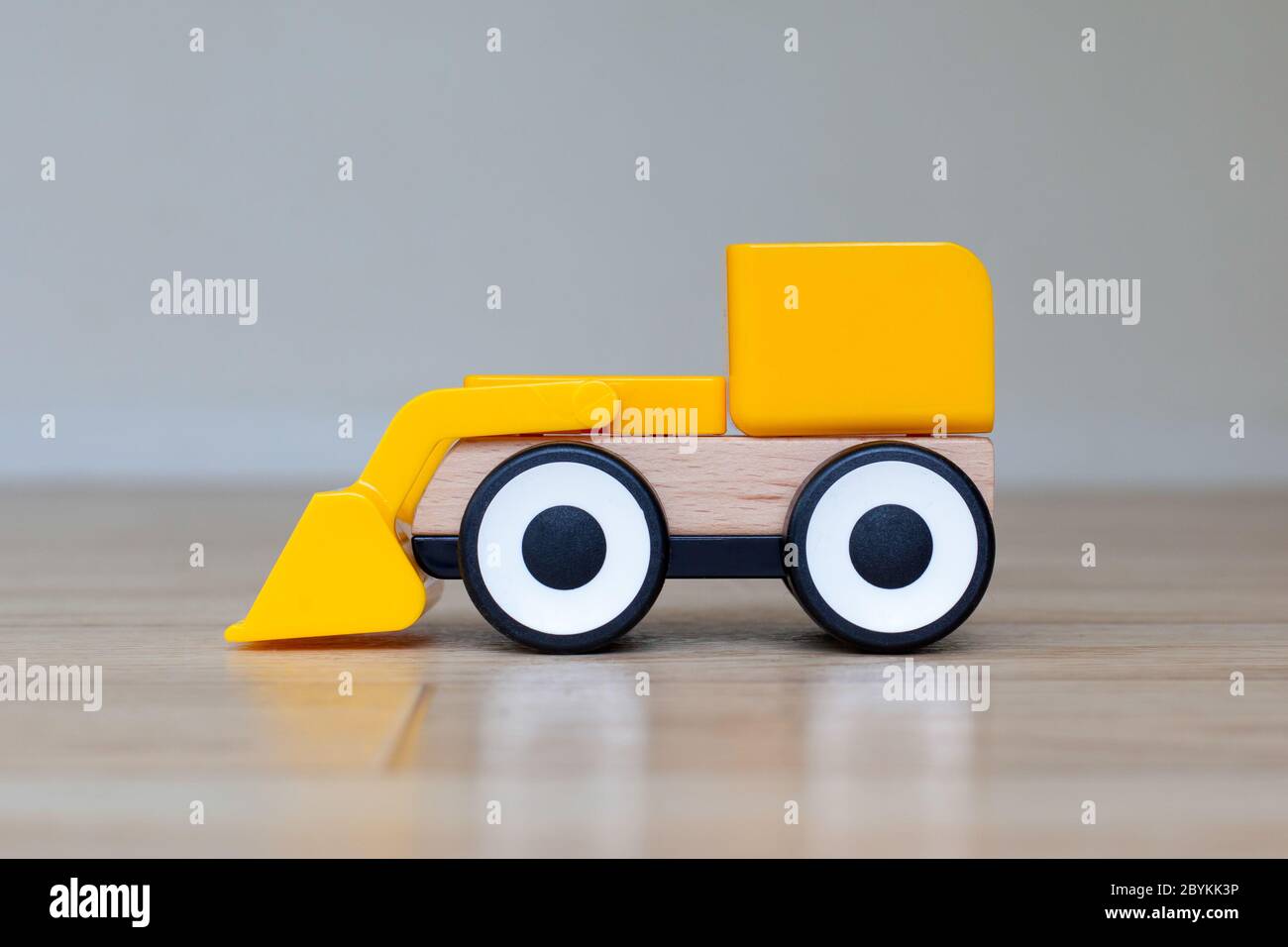 Simple wheel dozer toy Stock Photo - Alamy
